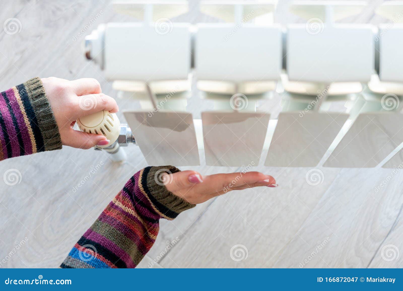 Radiator Adjustment Closeup. Female Hand Adjusting Radiator Temperature ...