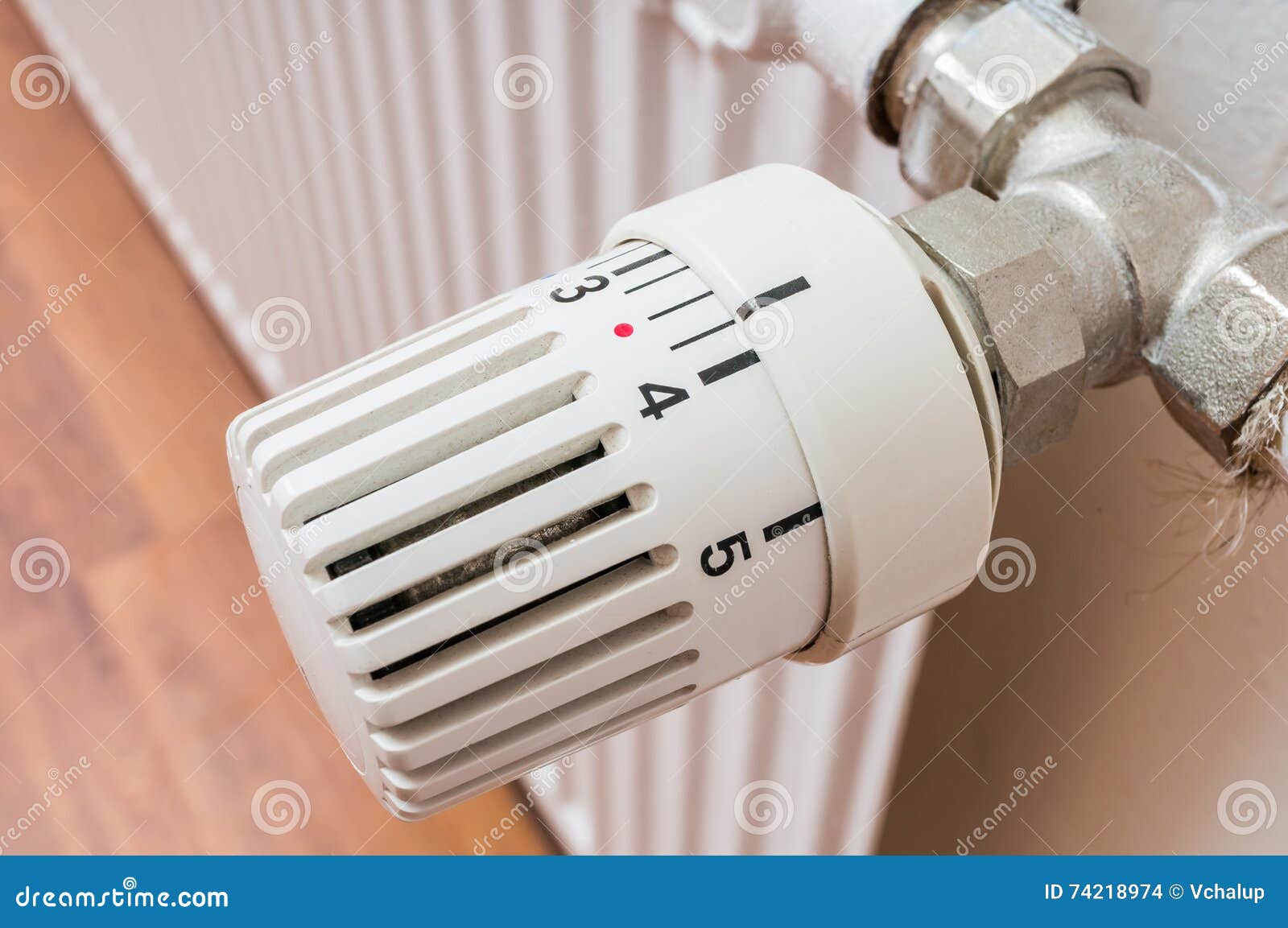 Adjusting Temperature On Radiator Thermostat Central Heating Control ...