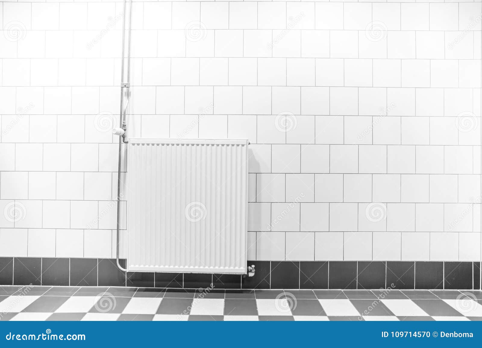 Radiator on the wall stock photo. Image of object, tiles - 109714570