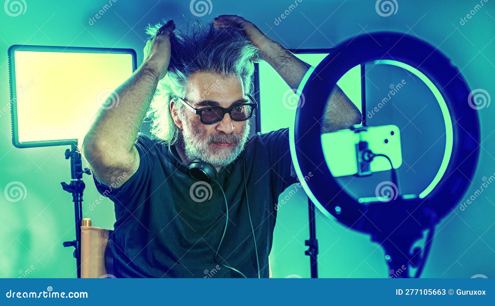 Freaky Man Going Crazy Inside Colored Studio Surrounded Camera Stuff ...