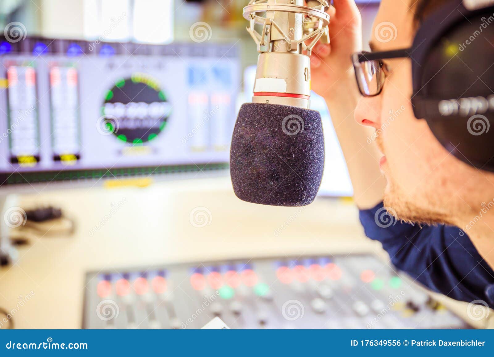 Radio Moderator is Sitting in a Modern Broadcasting Studio and Talking ...