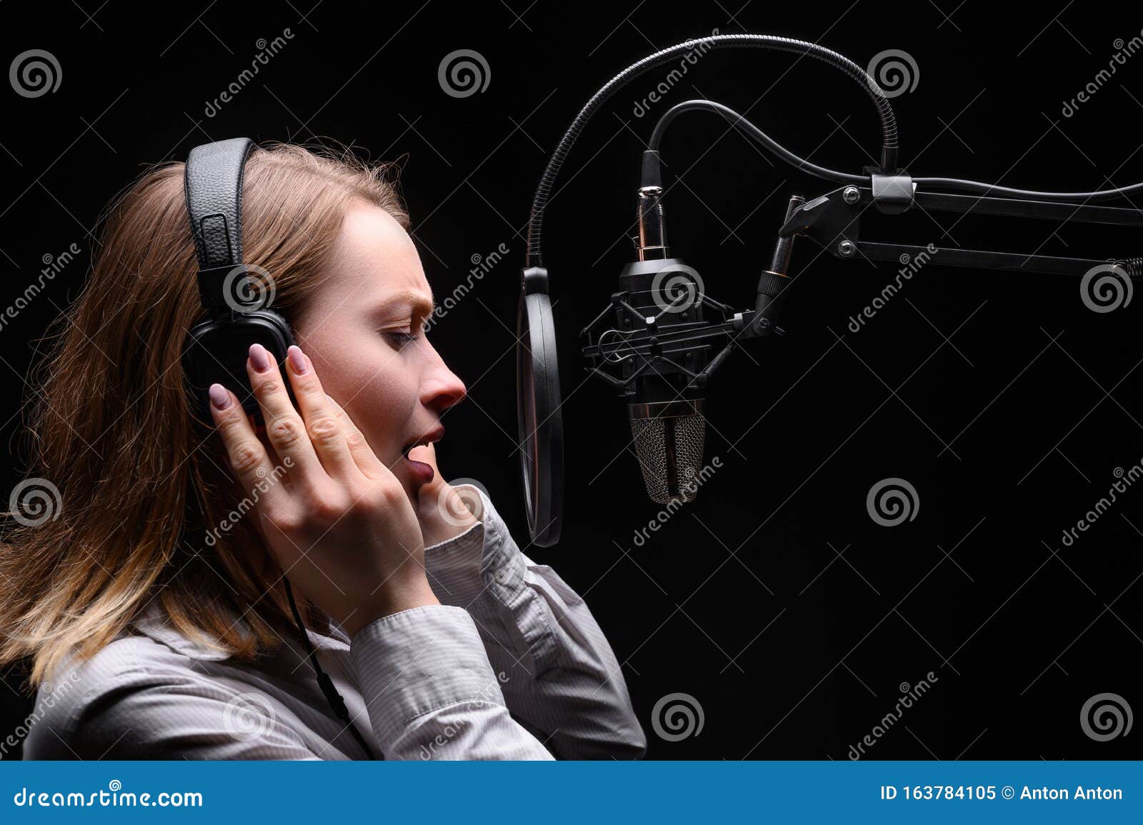 Radio Presenter Working on the Radio, with Dramatic Light Stock Image ...