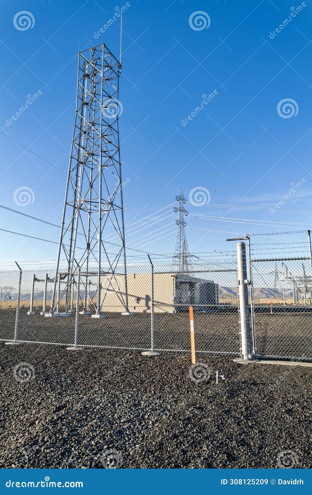 A Radio Tower Behind a Chain-link Fence at an Electrical Substation ...