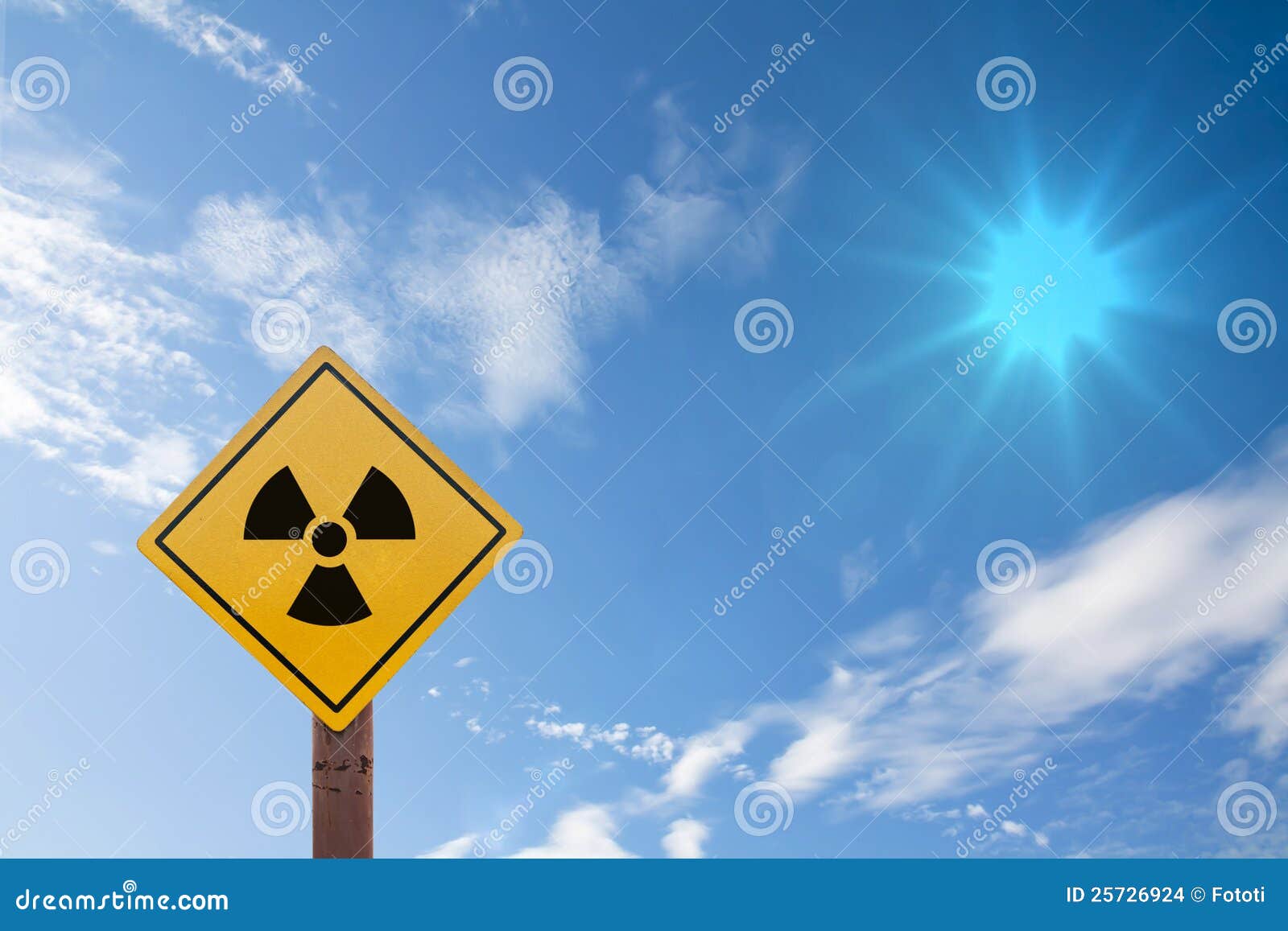 Radioactivity Warning Symbol on Blue Sky Backgroun Stock Photo - Image ...
