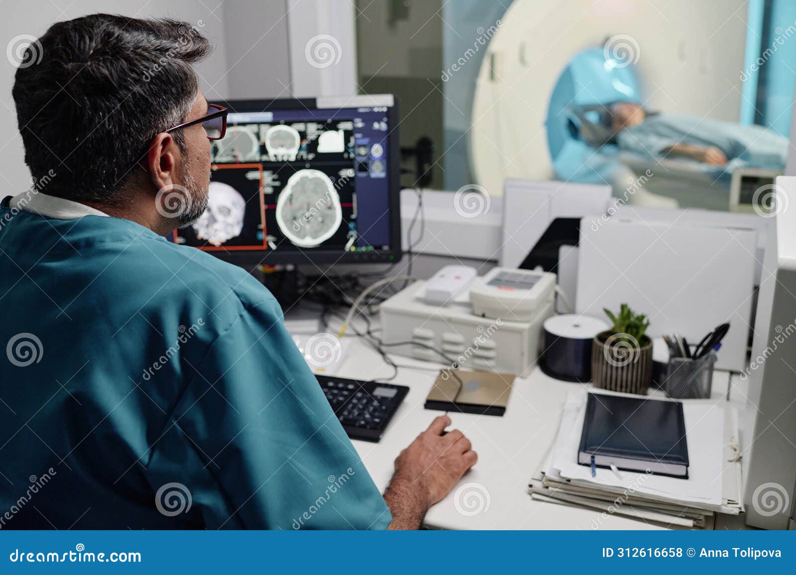 Radiographer Controlling CT Scanner at Work in Hospital Stock Photo ...