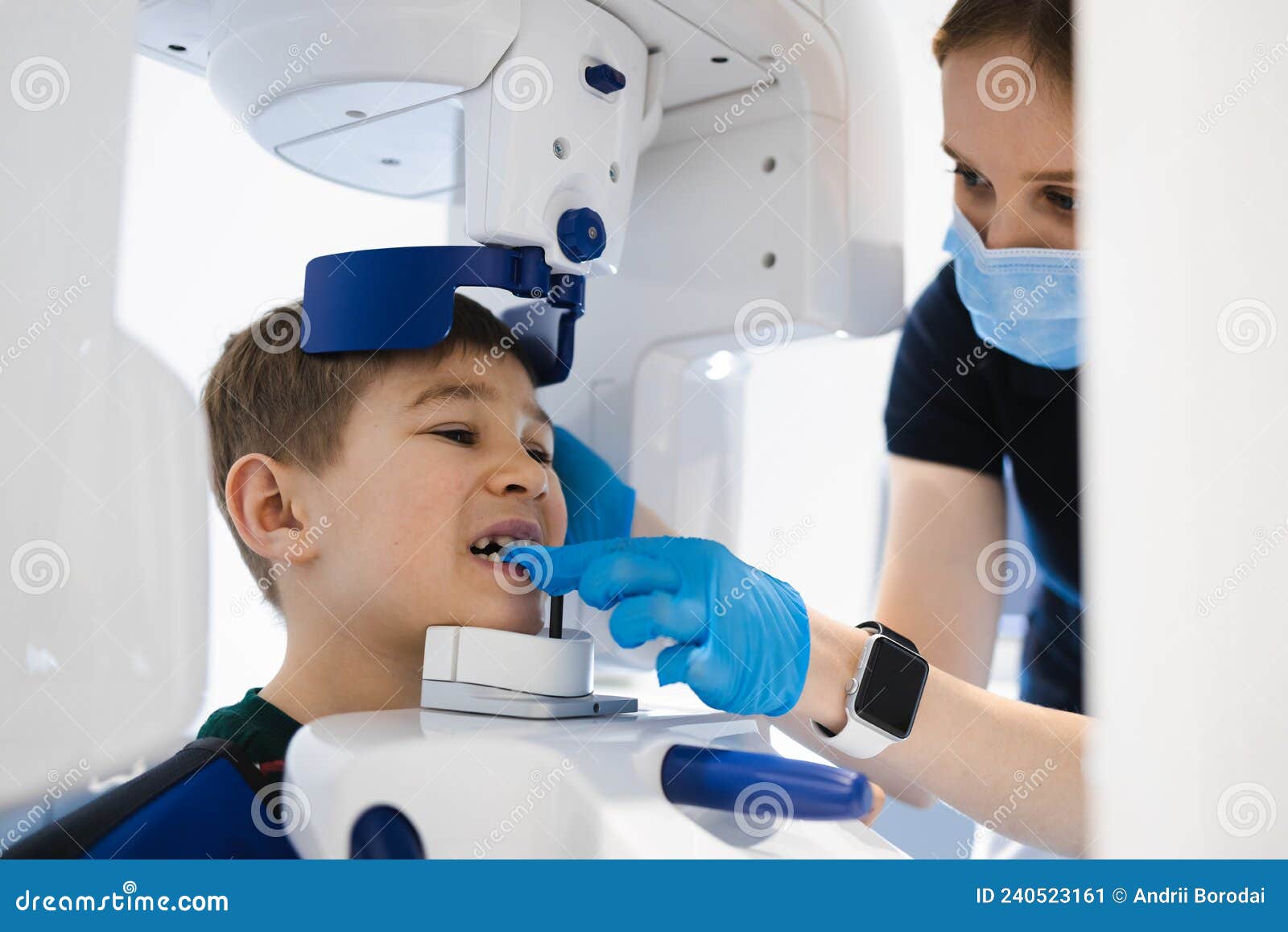 Radiographer Taking Panoramic Teeth Radiography To A Little Boy Using ...