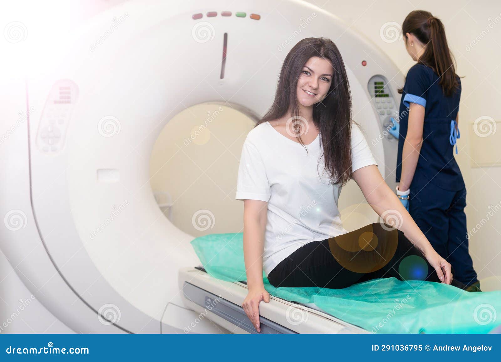 Radiologic Technician and Patient Being Scanned and Diagnosed on ...