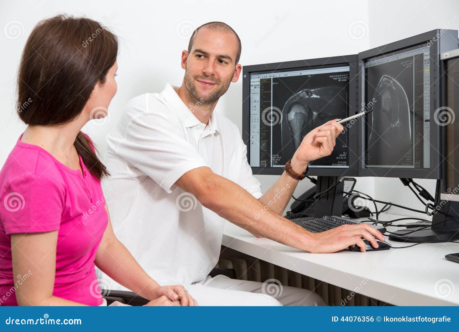 Radiologist And Patient In A X-ray Room. Classic Ceiling-mounted X-ray ...