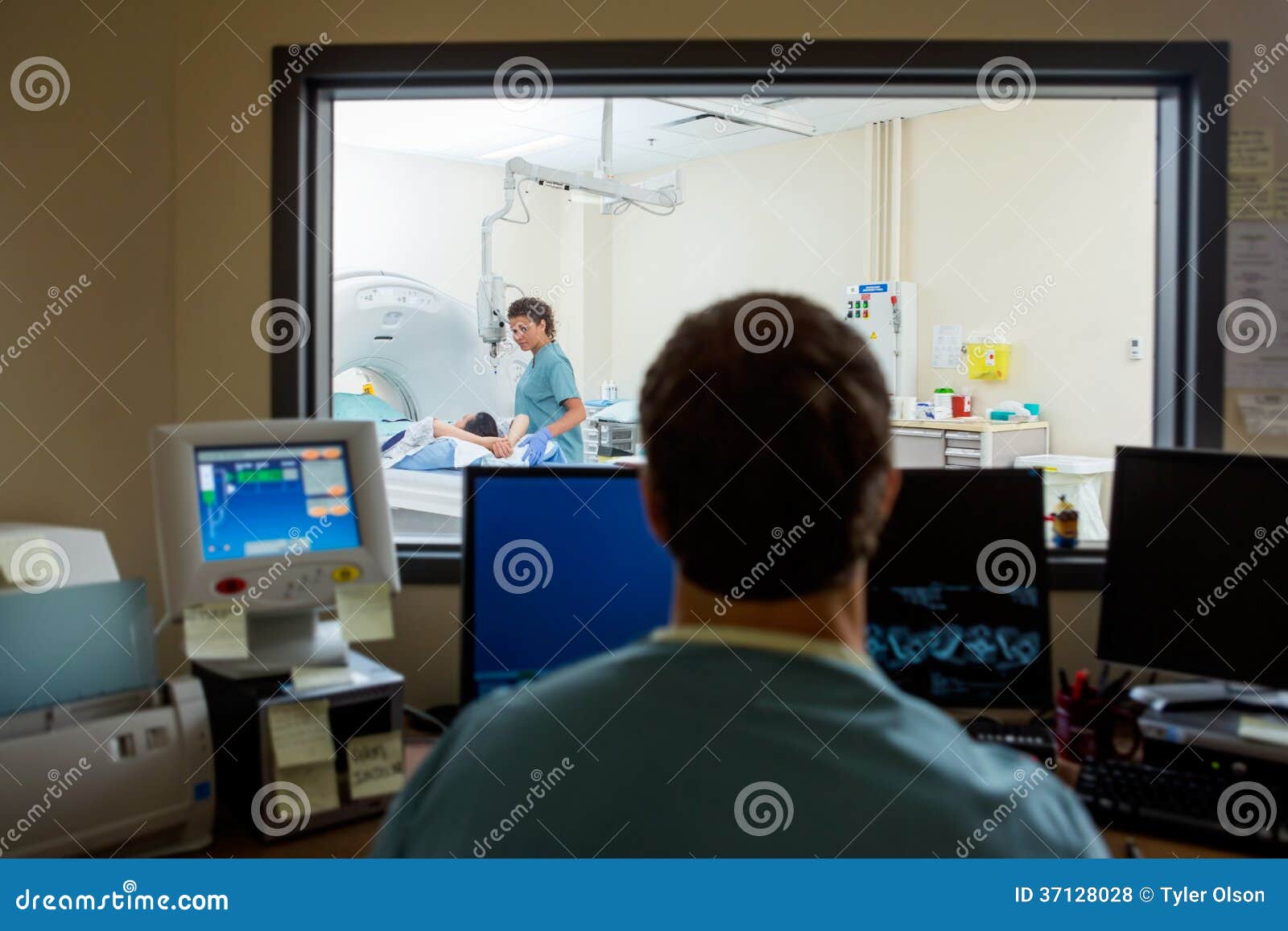 Radiologist in CT Scan Lab stock photo. Image of patient - 37128028