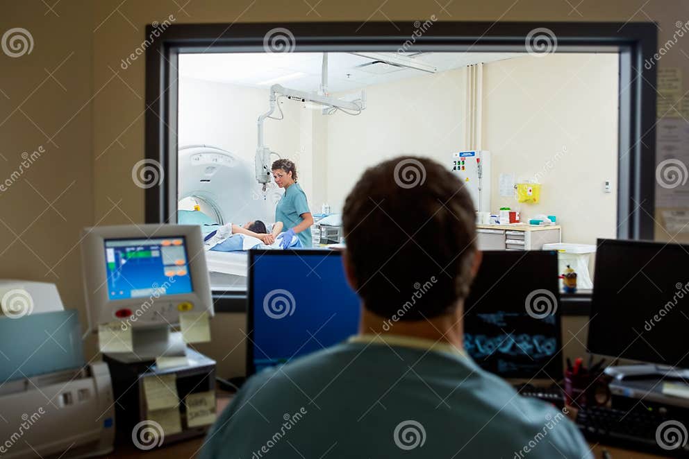 Radiologist in CT Scan Lab stock photo. Image of patient - 37128028
