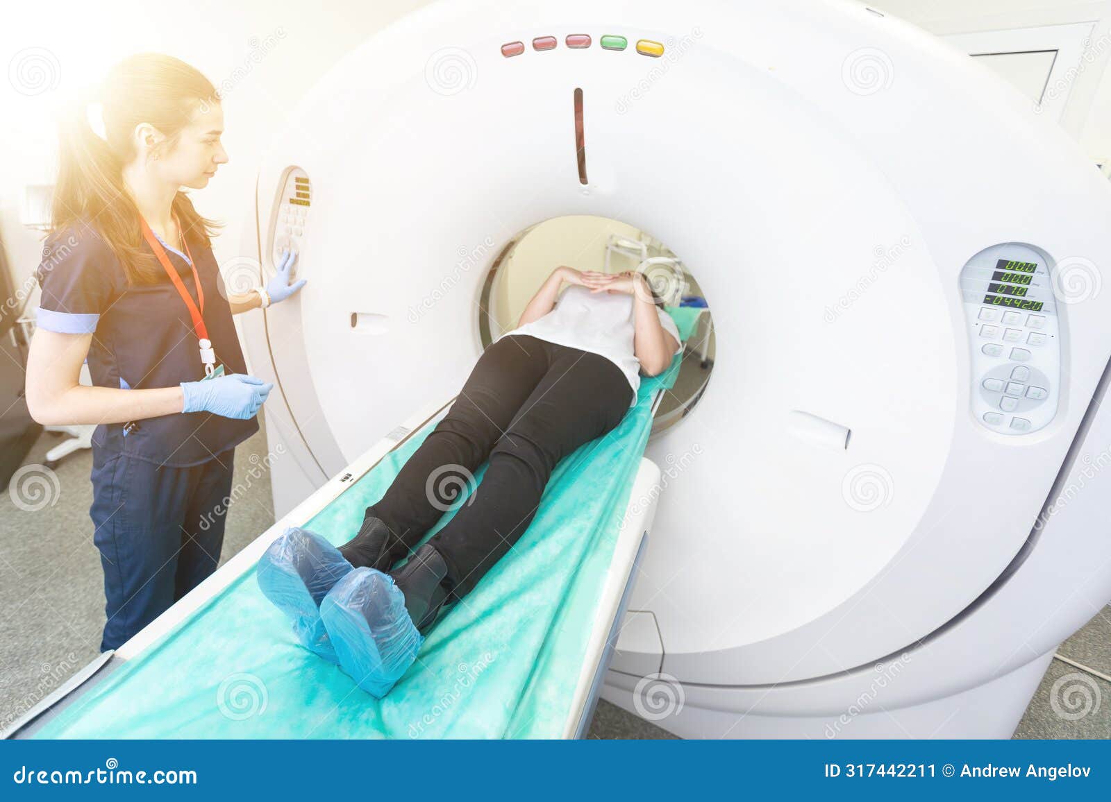 Radiologist with a Female Patient in the Room of Computed Tomography ...