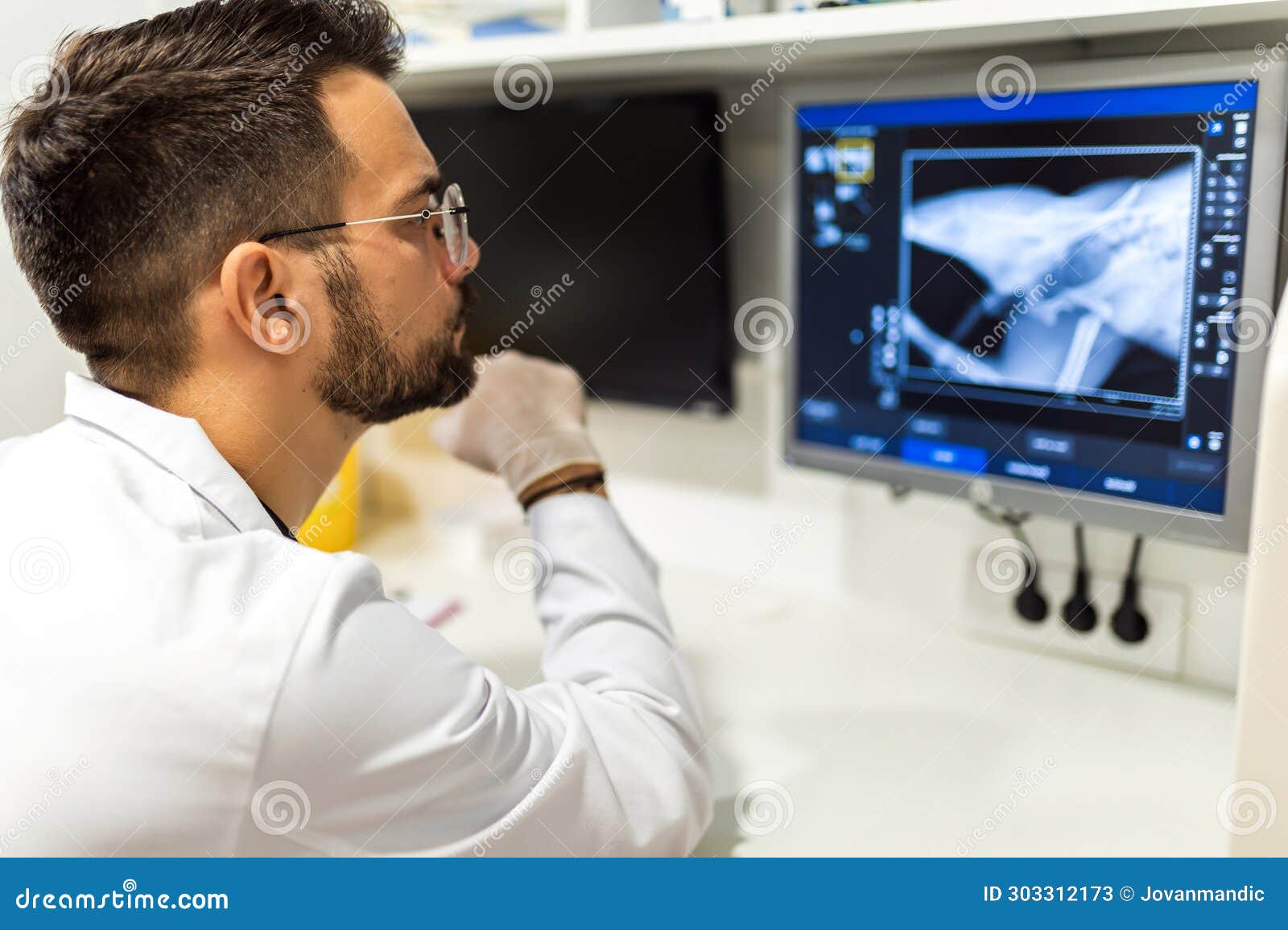 A Radiologist Looks at an X-ray Image Stock Image - Image of illness ...