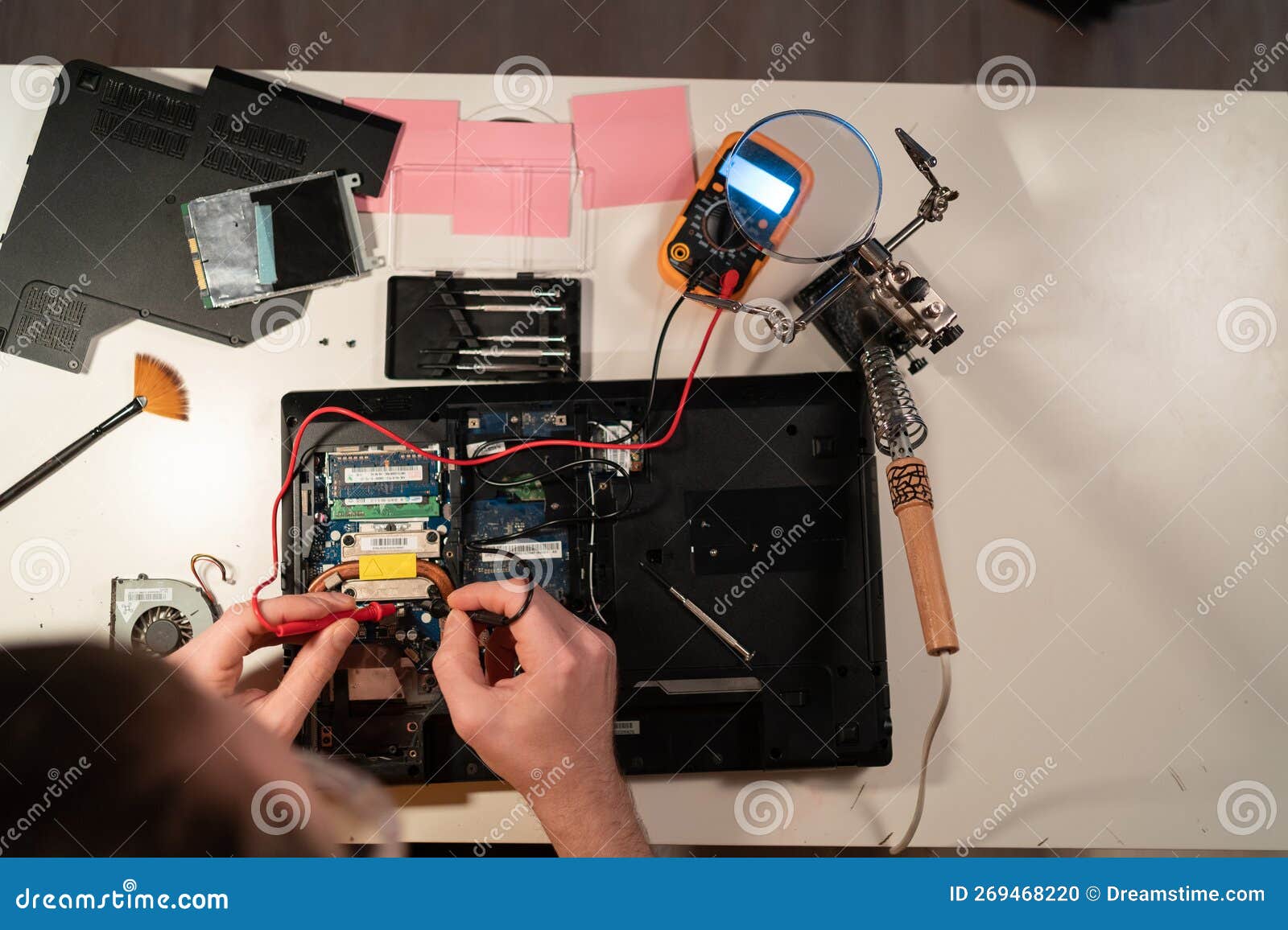 Radioman Testing Electric Current in Circuit Board of Disassembled ...