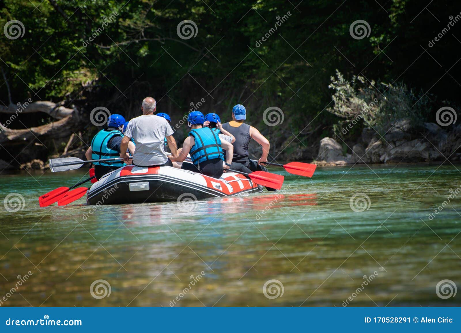 Rafting Team Goes Down the River on the Beautiful Sunny Day. Back View ...