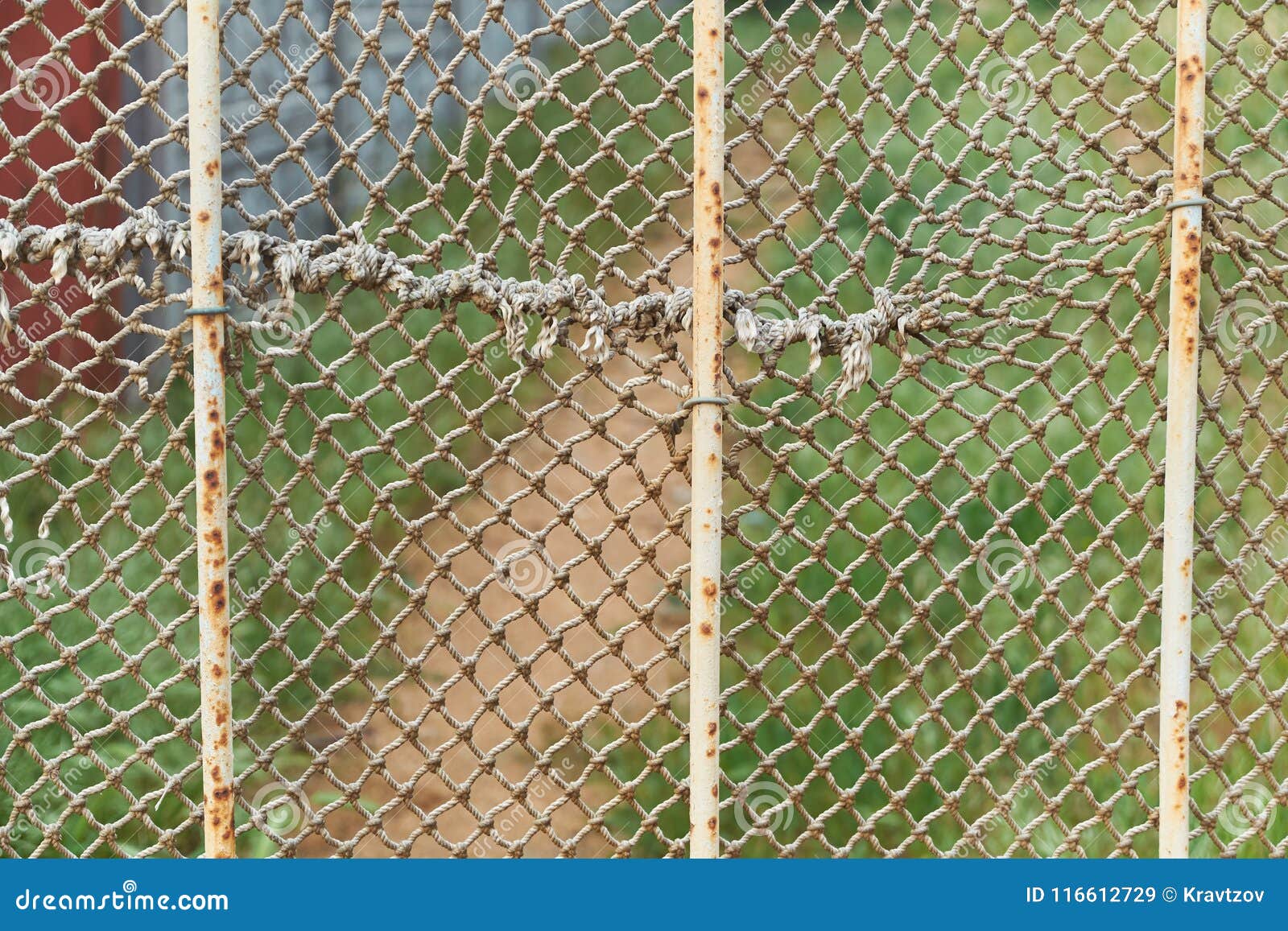 Ragged Rope Net is on the Rusty Iron Fence Stock Image - Image of ...