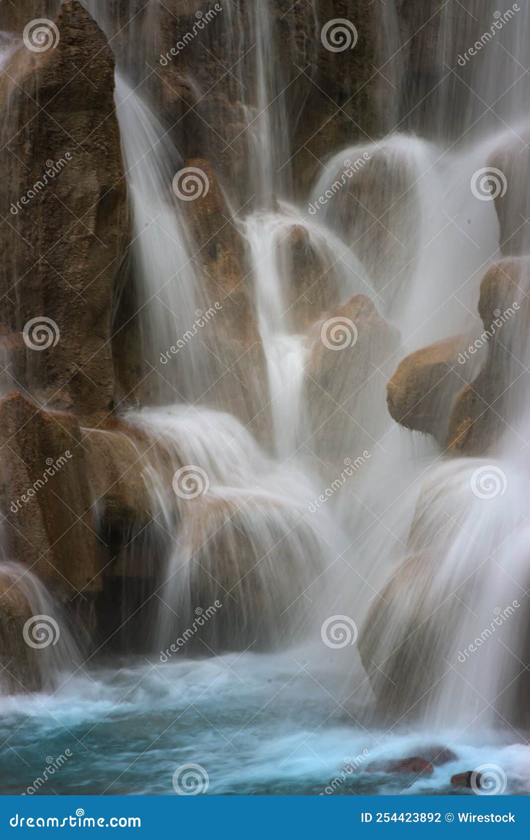 Raging Waterfalls Surrounded by Rocks Stock Photo - Image of energy ...