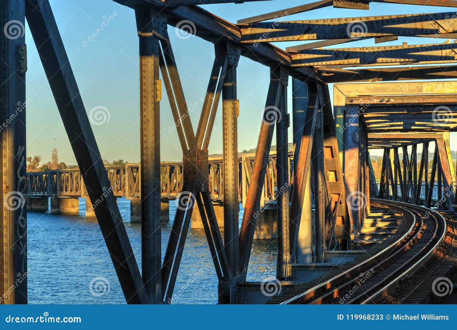 Rail Bridge Over Water, Catching the Last Rays of the Sun Stock Image ...