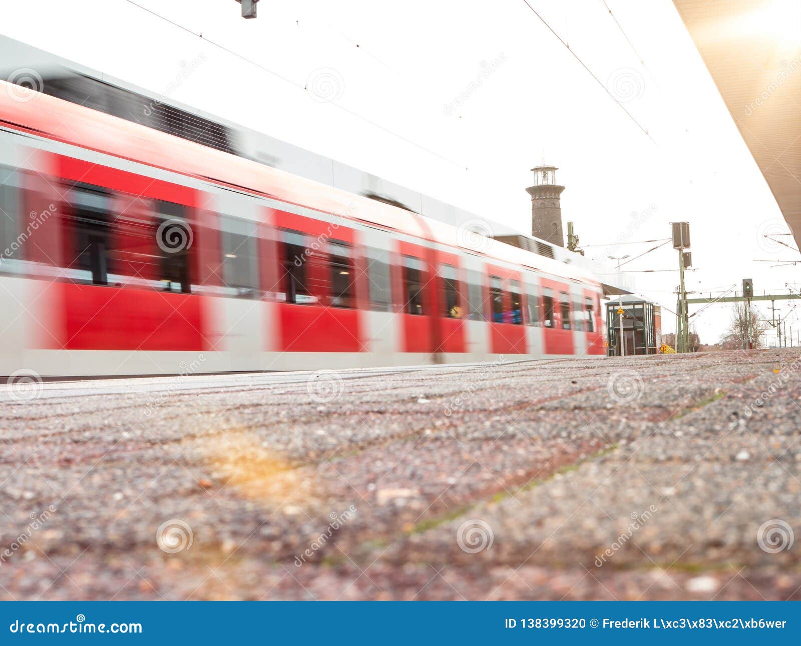 Rail Platform with Red Commuter Train in Motion Blur Stock Photo ...