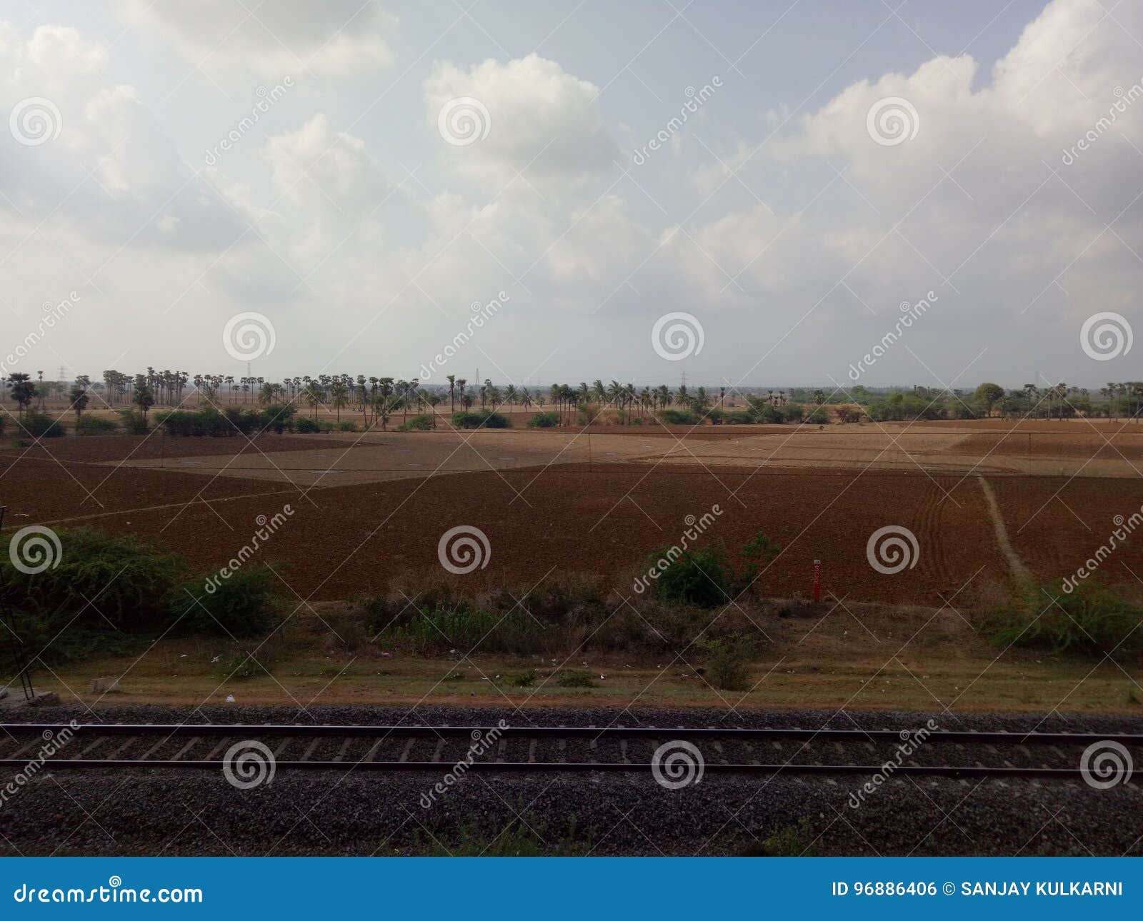 Rail Track with Agri Field stock photo. Image of travelling - 96886406