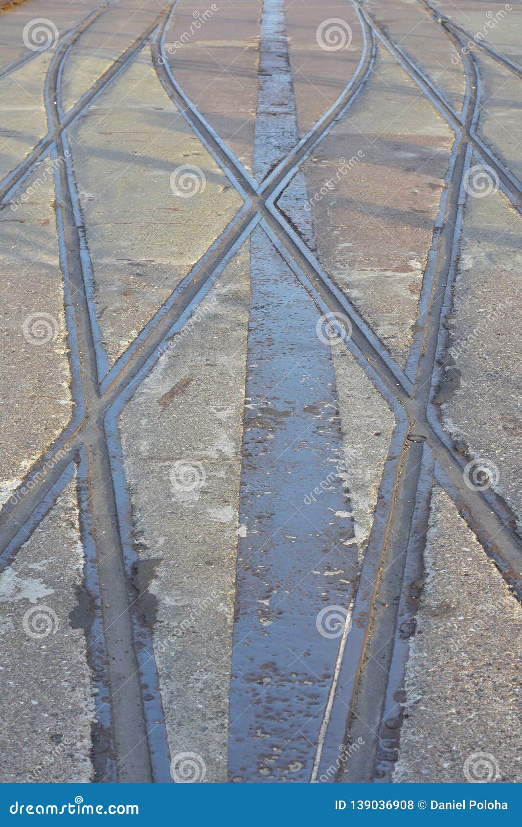 Rail tracks on paved road stock photo. Image of paved - 139036908