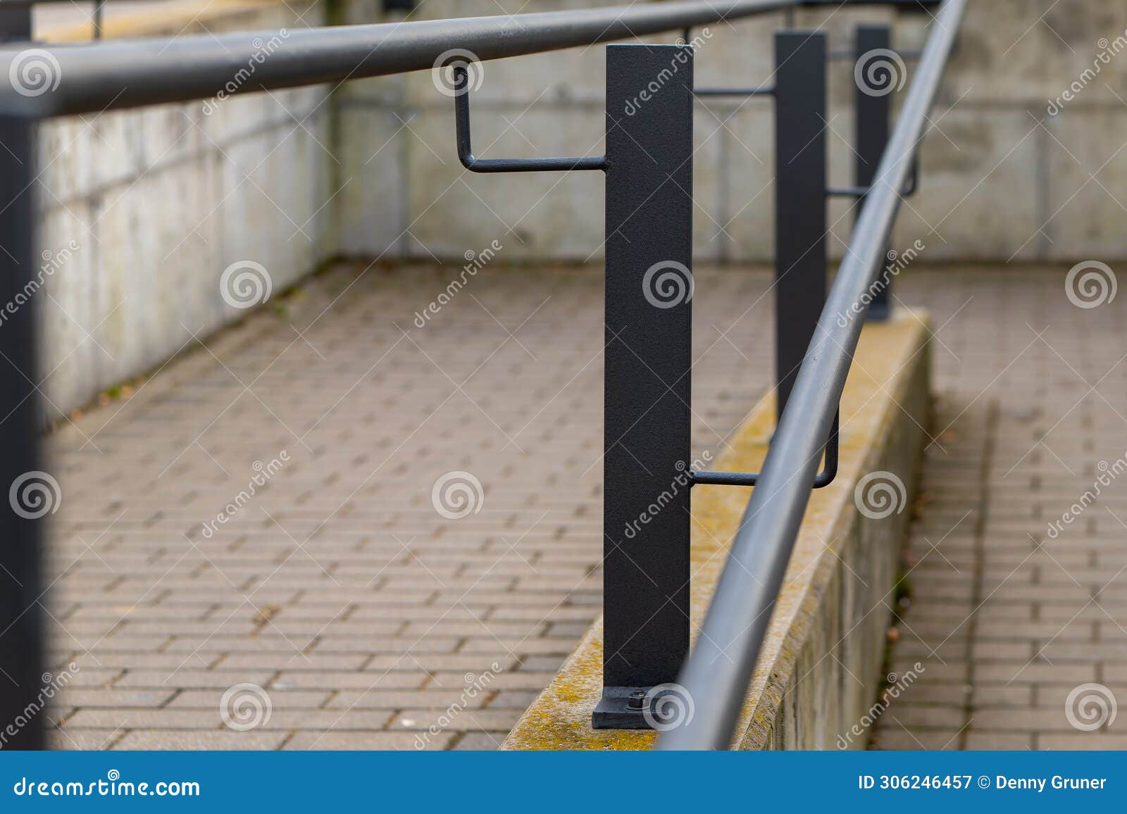 A railing on a footpath stock image. Image of construction - 306246457