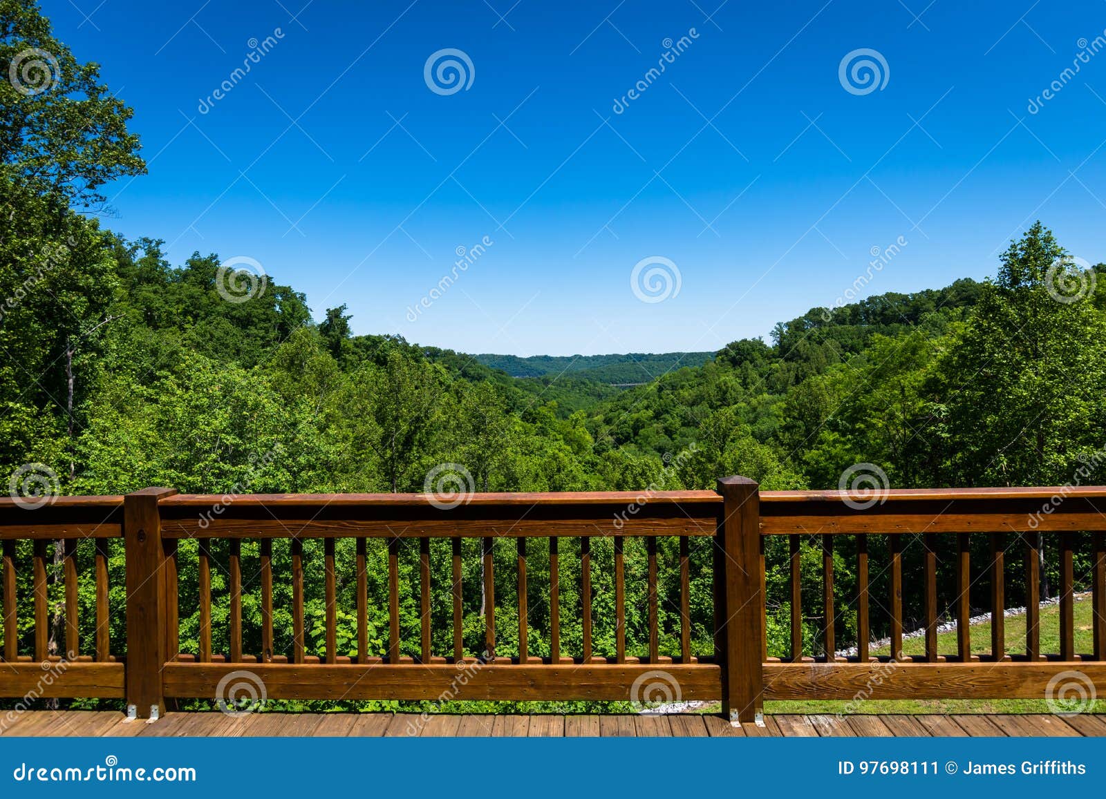 Railing overlooking valley stock image. Image of deck - 97698111