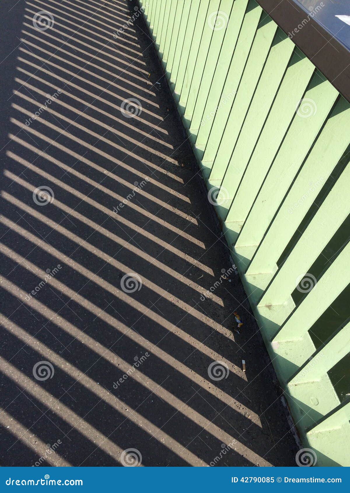 Railing shadow on a bridge stock image. Image of sidewalk - 42790085