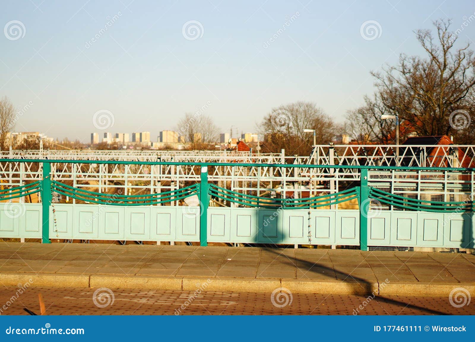 Railing on a Sidewalk at a Park with Trees in the Background Stock ...