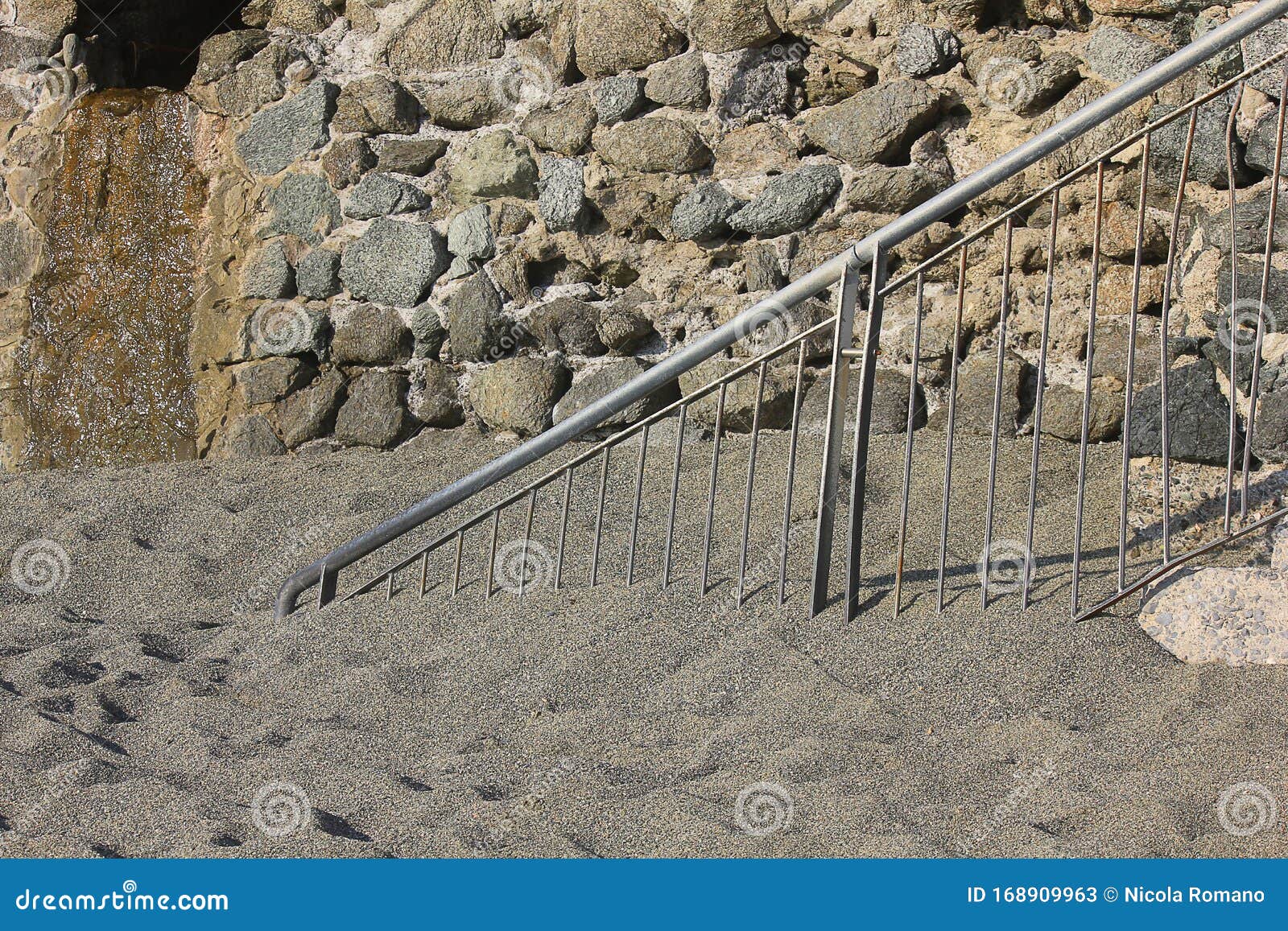 Railing Under the Sand on the Beach Stock Image - Image of seacoast ...