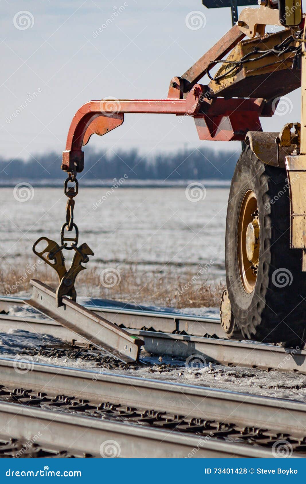 Railroad Crane Lifting Piece of Rail Stock Photo - Image of train ...