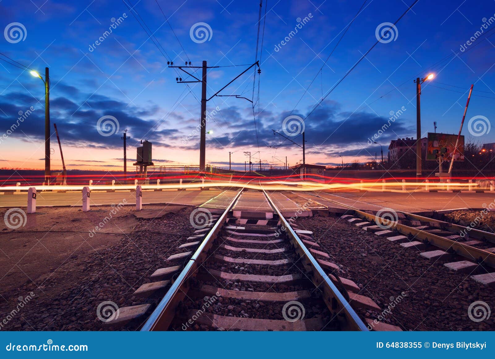 Railroad Crossing with Car Lights in Motion at Night Stock Image ...