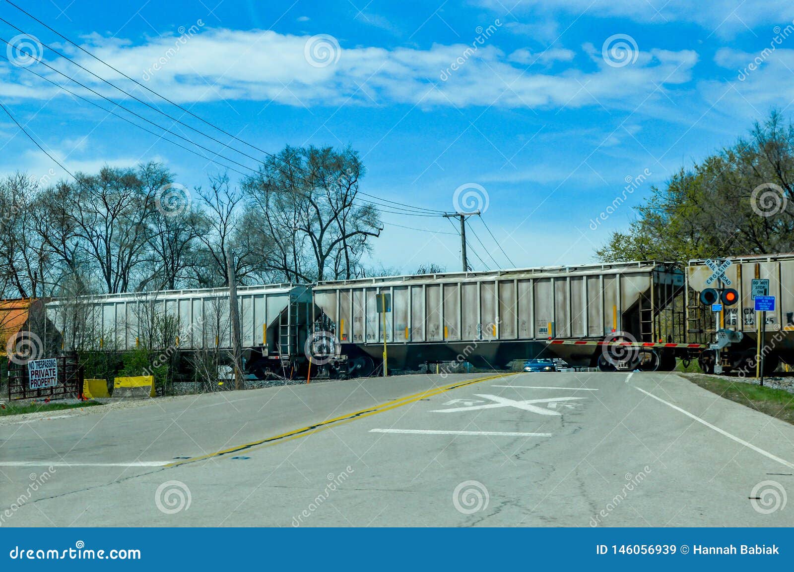 Railroad Crossing with a Train Crossing Over Intersection Editorial ...