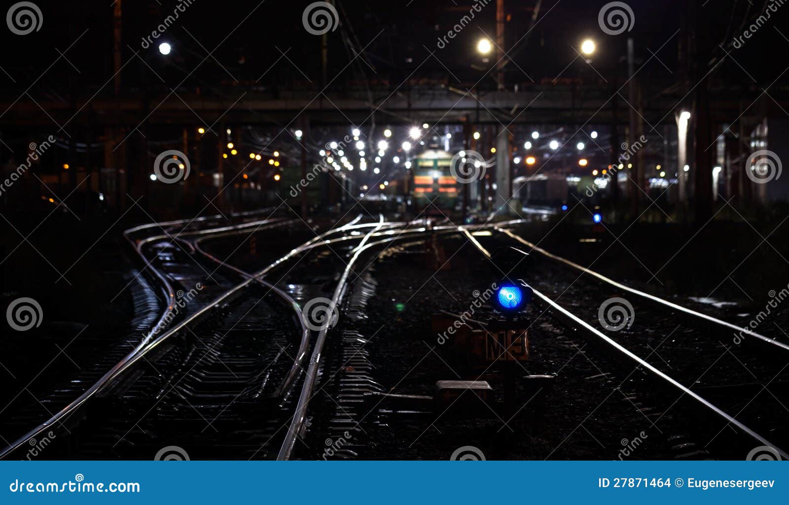 Railroad Night Scene with Blue Traffic Light Stock Photo - Image of ...