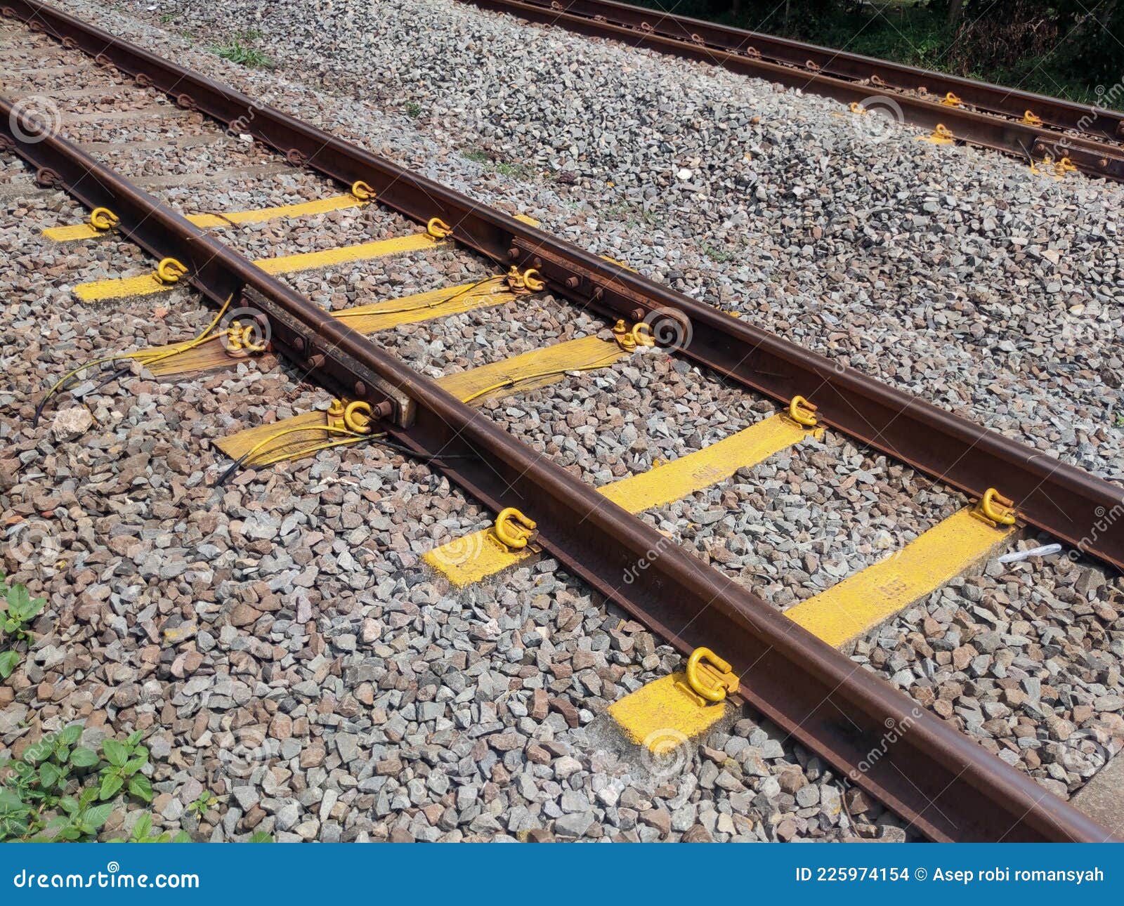 Railroad Track with a Yellow Marker, Apparently To Mark the Location of ...