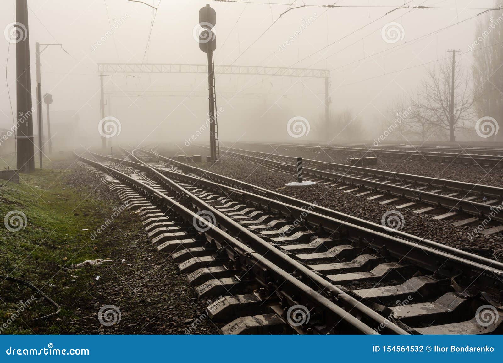Railroad Tracks in the Fog on Autumn Stock Photo - Image of light, path ...