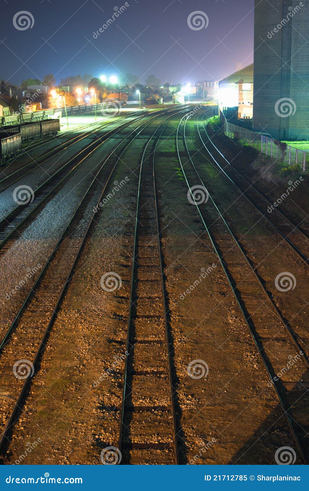 Railroad tracks at night stock image. Image of lights - 21712785