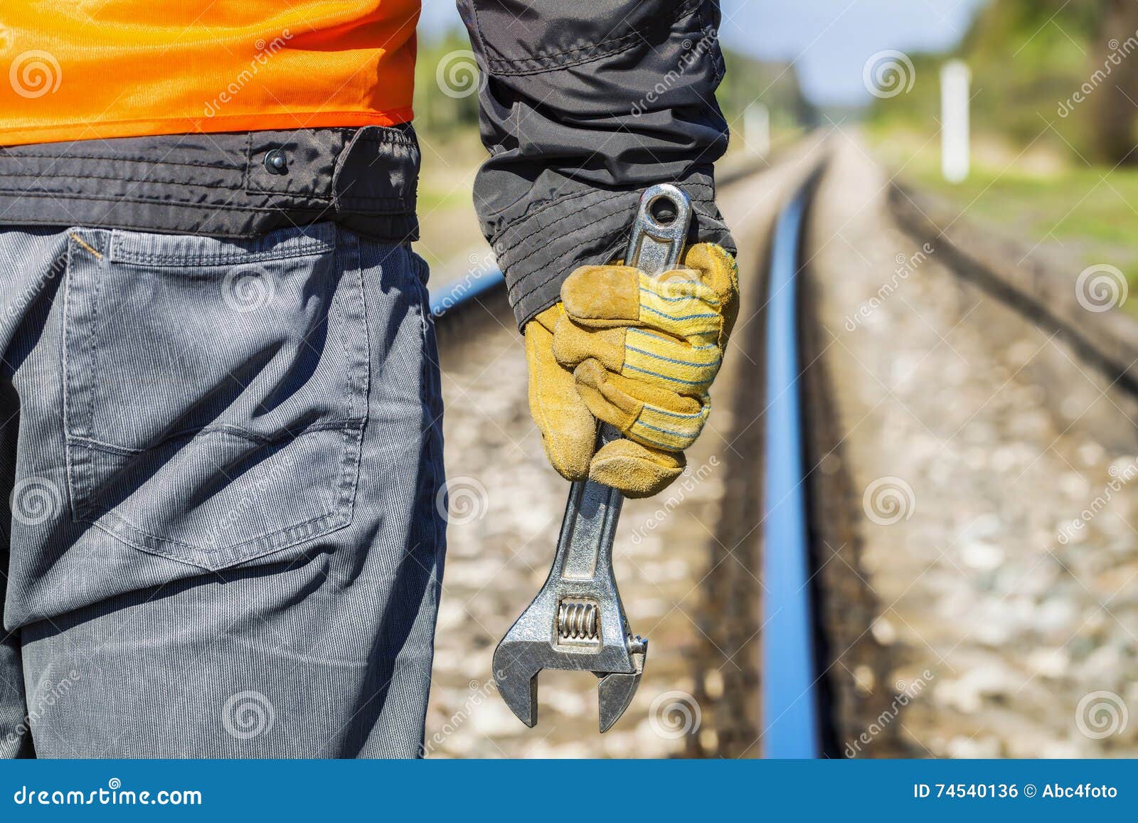 Railroad Worker with Adjustable Wrench on Railway in Spring Stock Photo ...