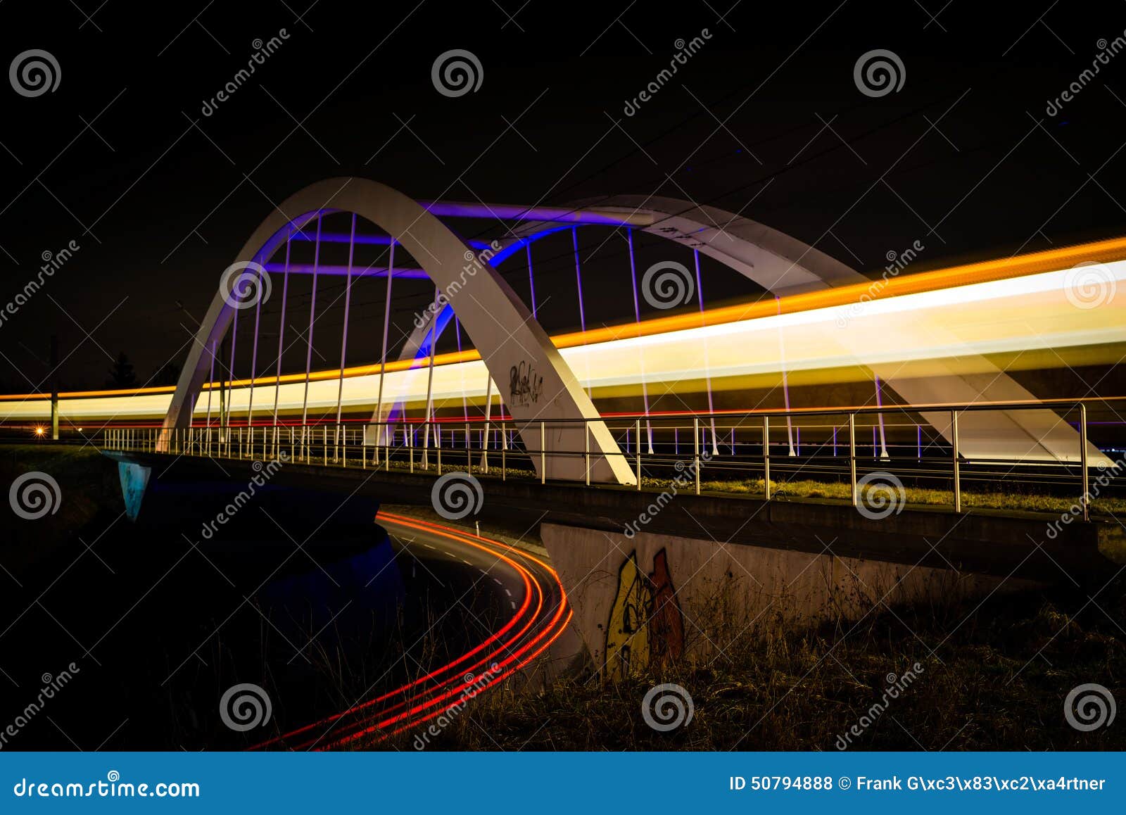 Railway Bridge with Train and Car Lights at Night Stock Photo - Image ...