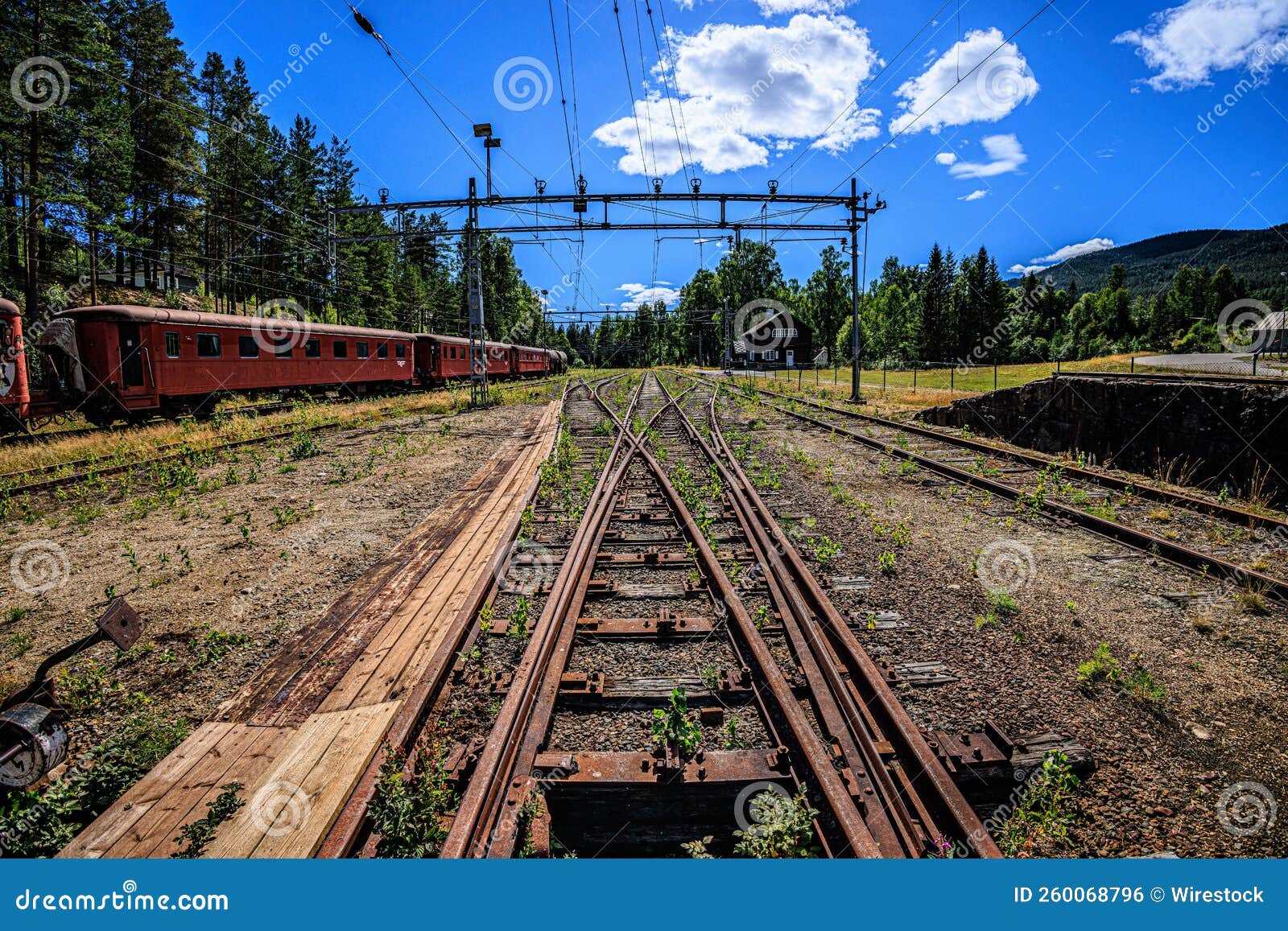 Railway in the Countryside with a Red Train on the Side Editorial Photo ...