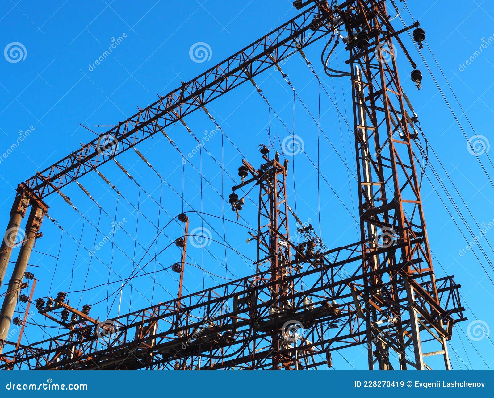 Railway Electrical Network with Iron Poles and Wires on a Blue Clear ...