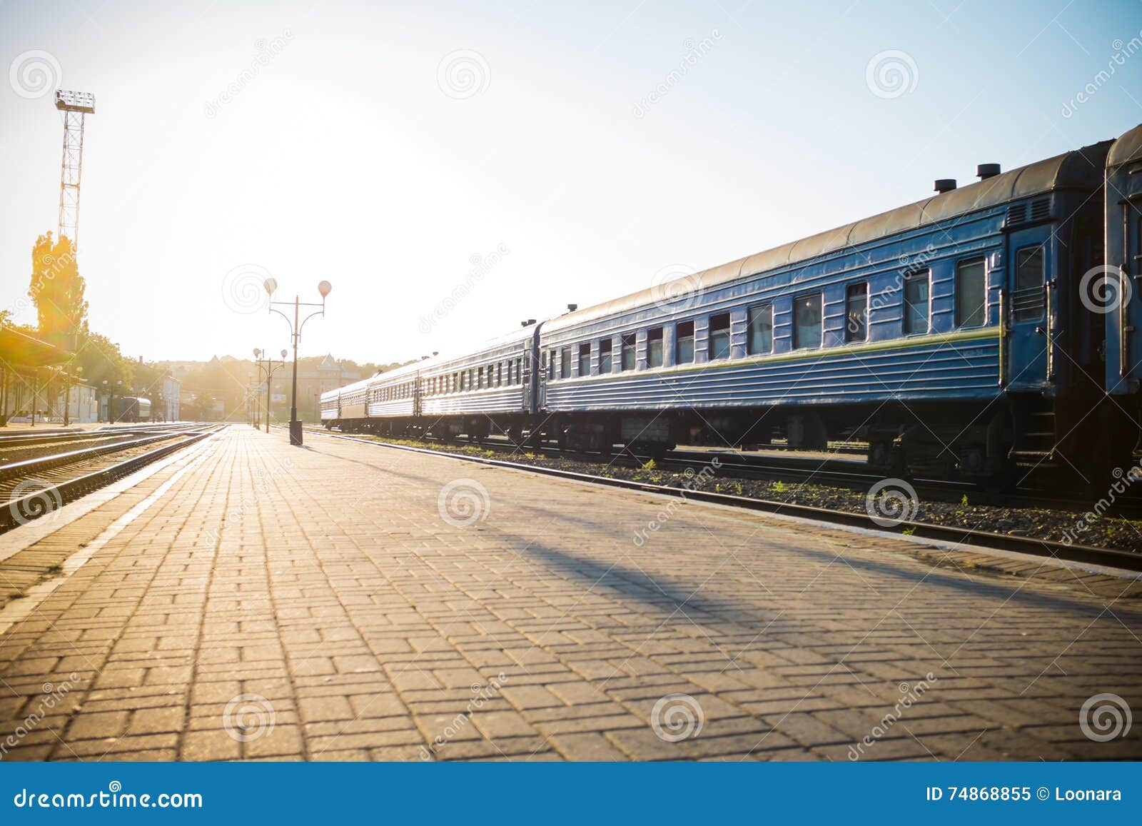 Railway Platform and a Train in the Sun Backlight Stock Image - Image ...