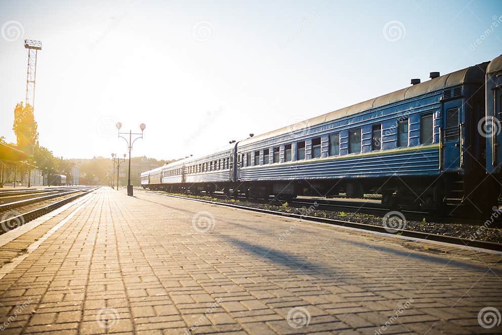 Railway Platform and a Train in the Sun Backlight Stock Image - Image ...