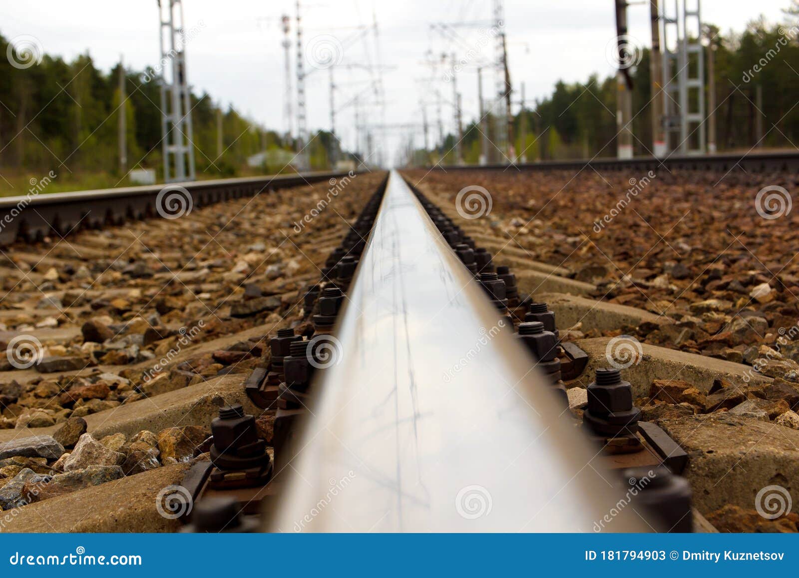 The Railway Rail with Electric Supports Going into the Distance Stock ...