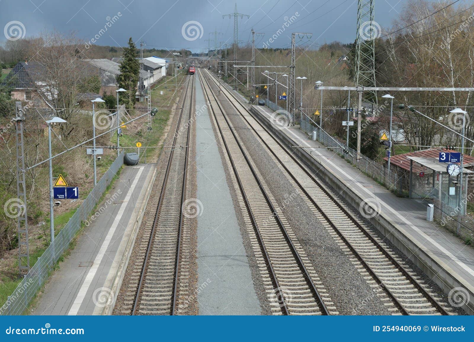 Railway Station with an Approaching Train on a Cloudy Day Stock Image ...
