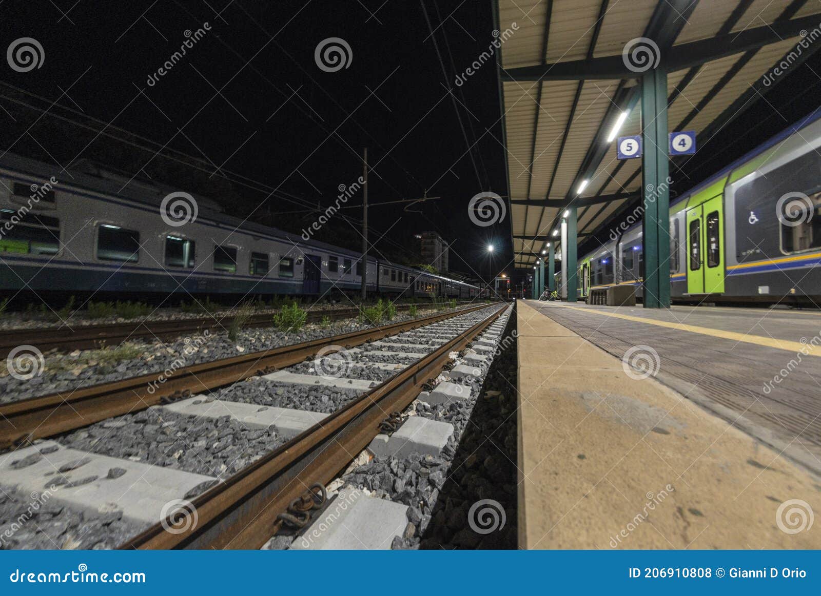 Railway Station with Train Waiting on the Tracks at Night Editorial ...