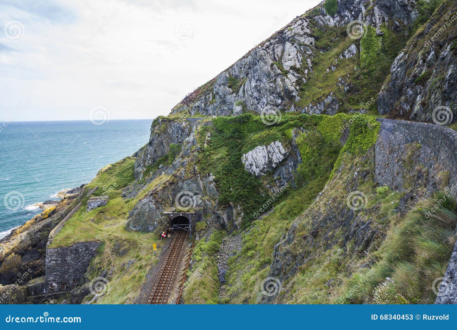 Railway through Stone Rocks Mountain at Irish Seacoast Stock Image ...