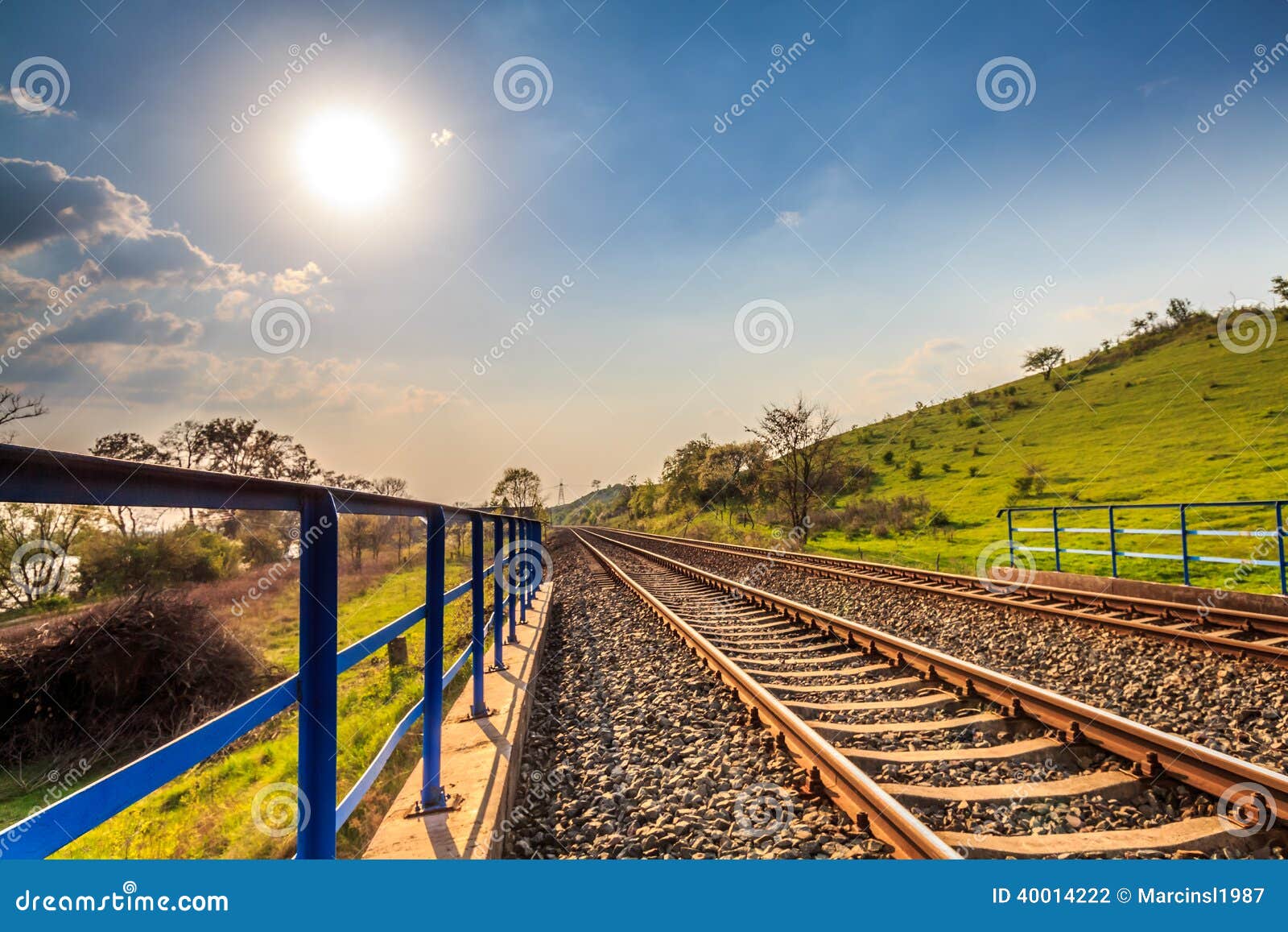 Railway during a sunny day stock photo. Image of hill - 40014222