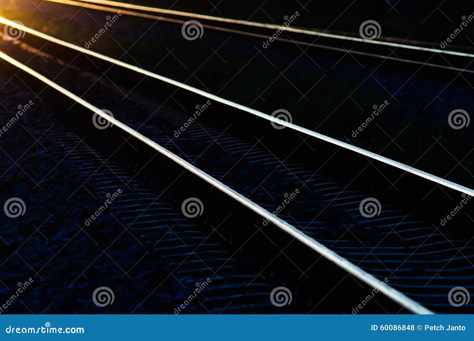 Railway Tracks in the Shadow Light of Sunset. Stock Photo - Image of ...