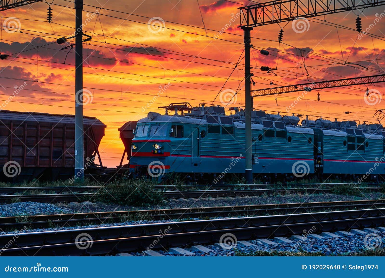 Railway Train and Rail Cars in a Beautiful Sunset, Dramatic Sky and ...