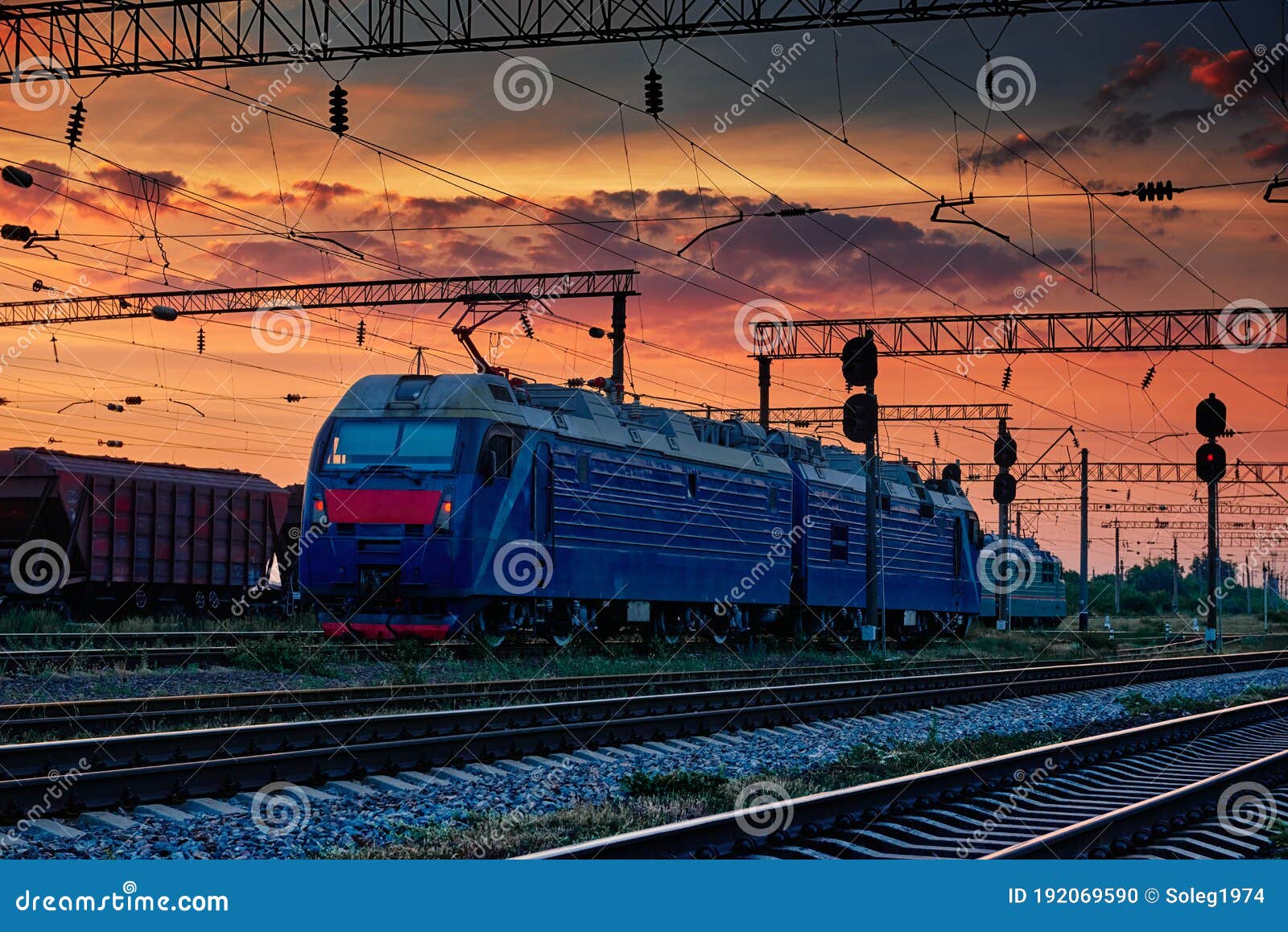 Railway Train and Rail Cars in a Beautiful Sunset, Dramatic Sky and ...